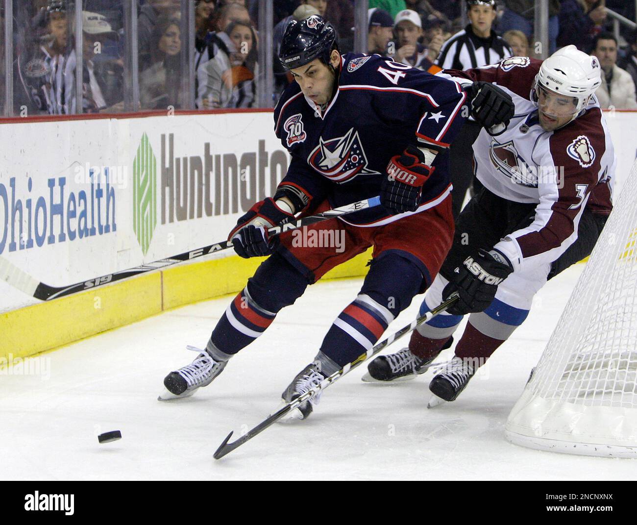 Colorado Avalanche's Ryan O'Byrne, right, and Columbus Blue Jackets ...