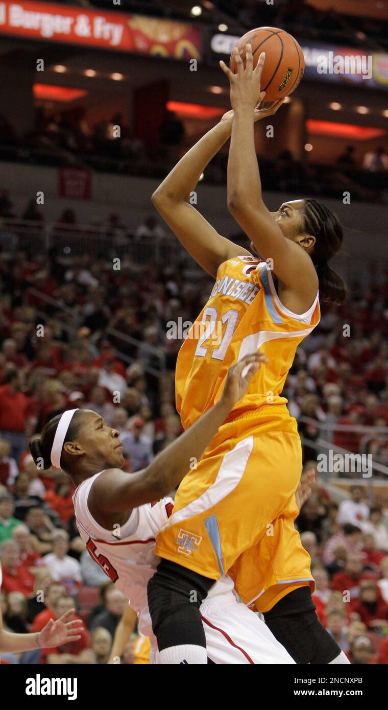 Tennessee's Vicki Baugh (21) goes over Louisville defender Keshia Hines ...