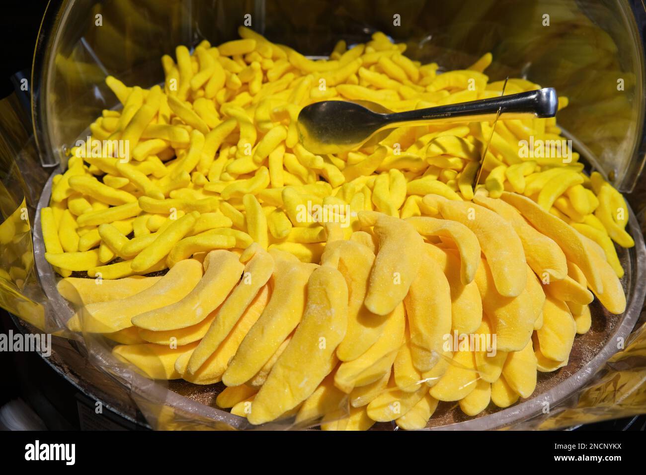 yellow gummy candies marshmallows jelly caramel sold in store self ...