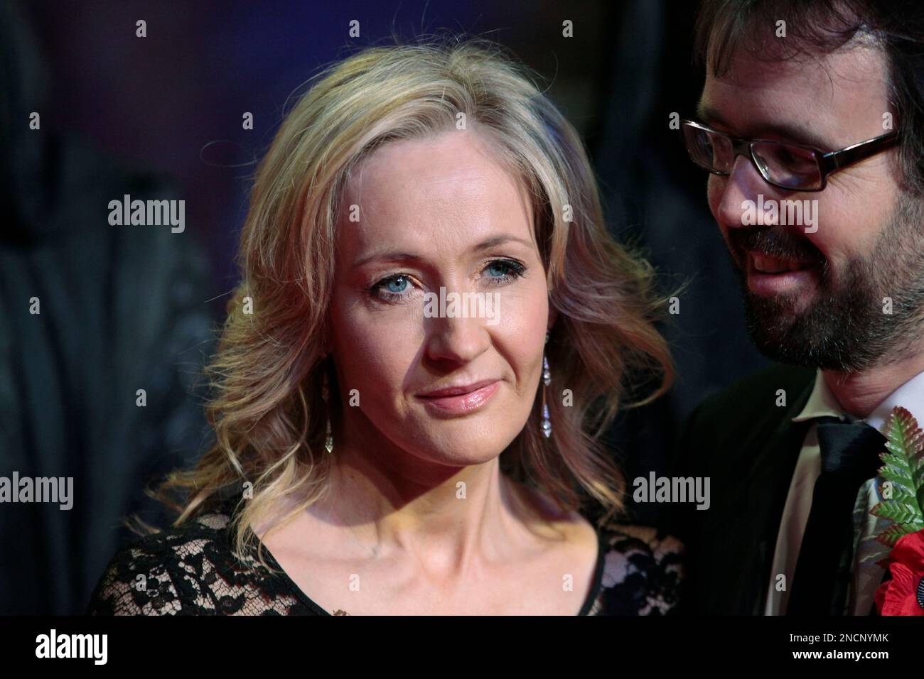 British author JK Rowling, left, accompanied by Neil Murray, poses for ...