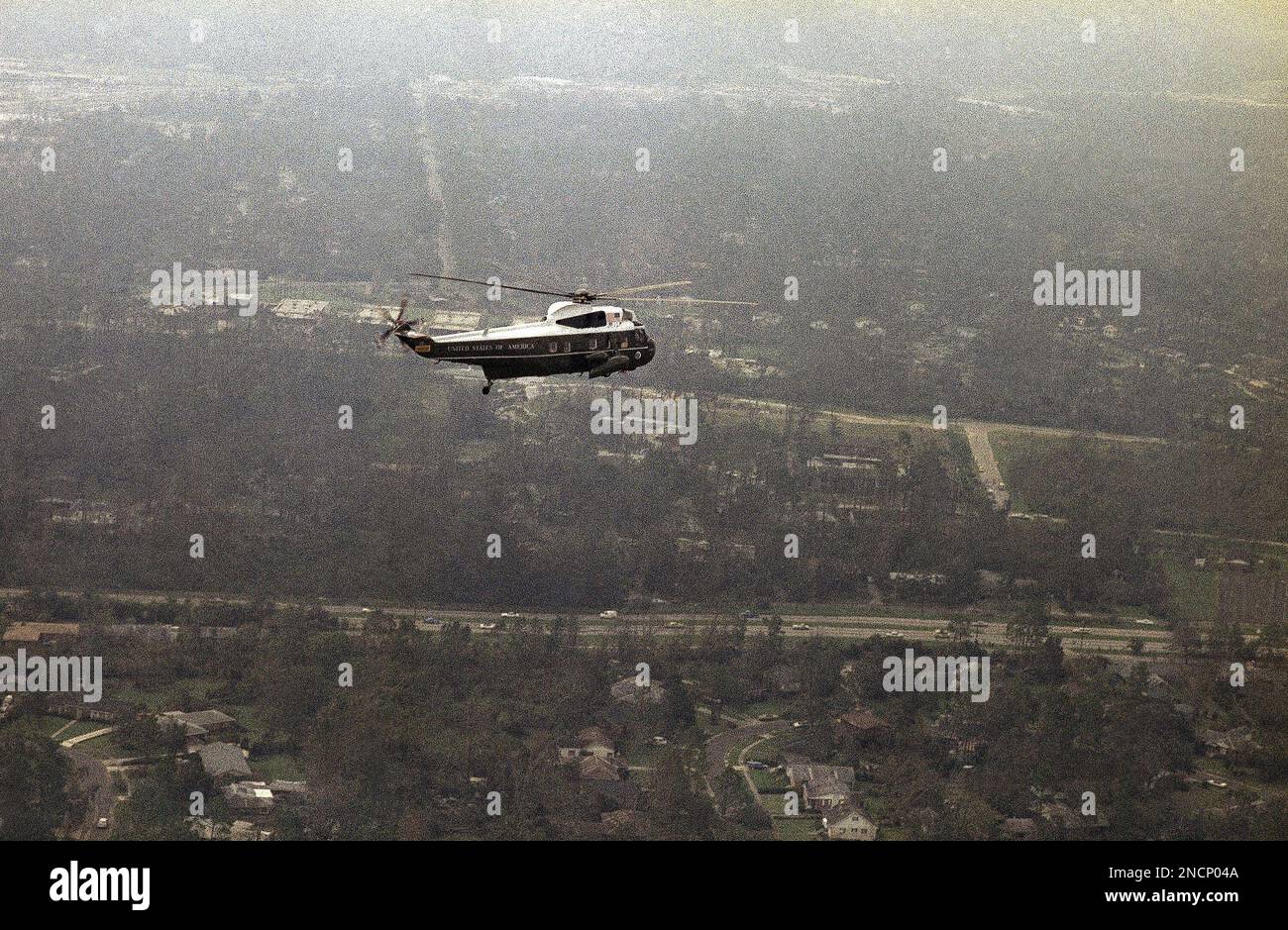 President Jimmy Carter in helicopter flew over areas in the south ...