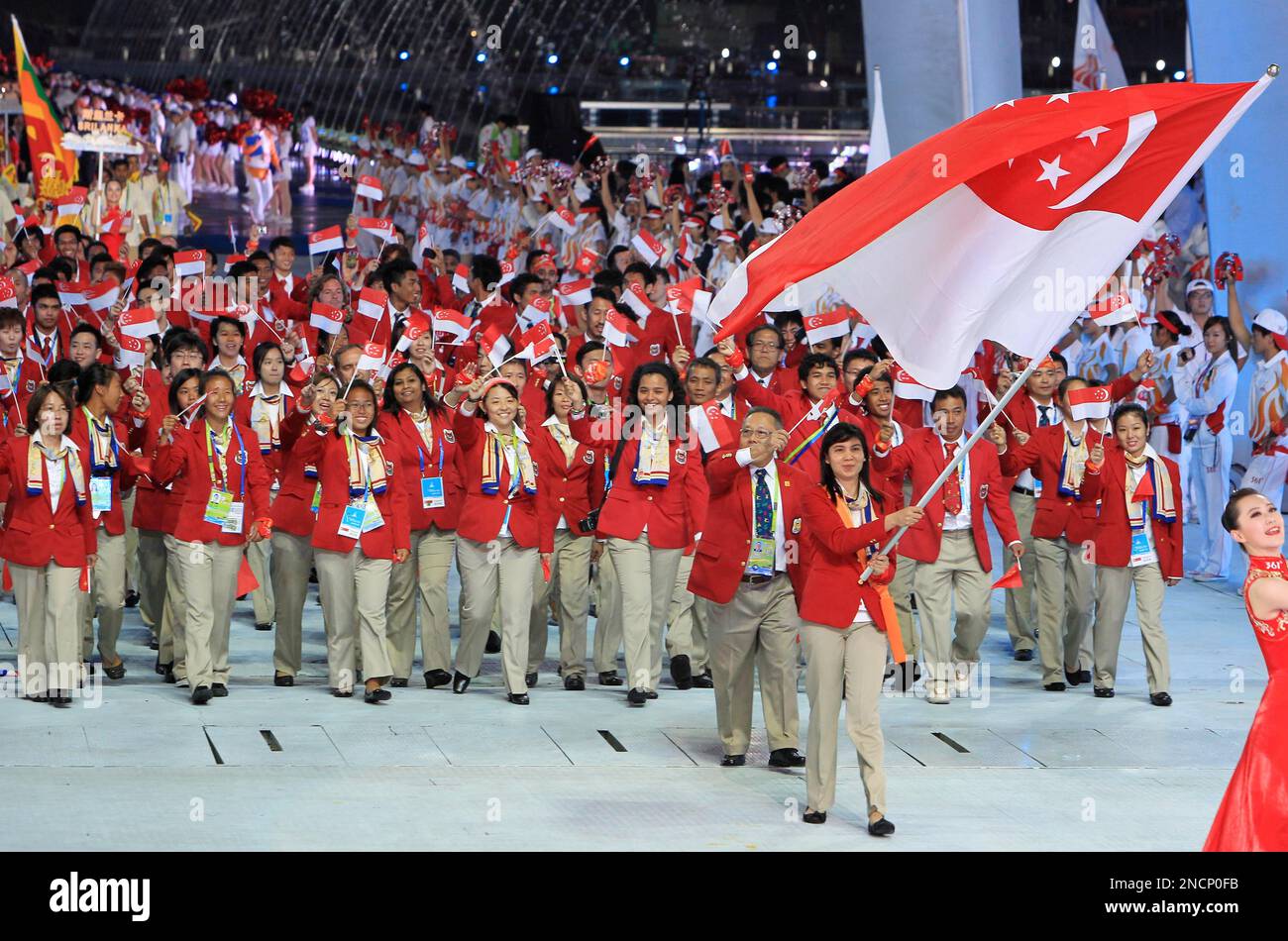 The Singapore team marches into the opening ceremony for the 16th Asian ...