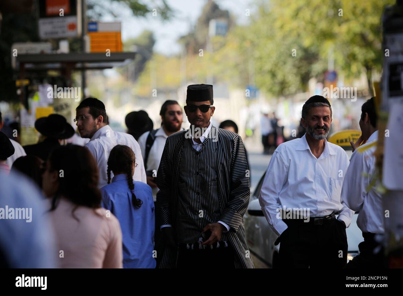 U.S. rapper Jamal "Shyne" Barrow, center, walks down a street in the ...
