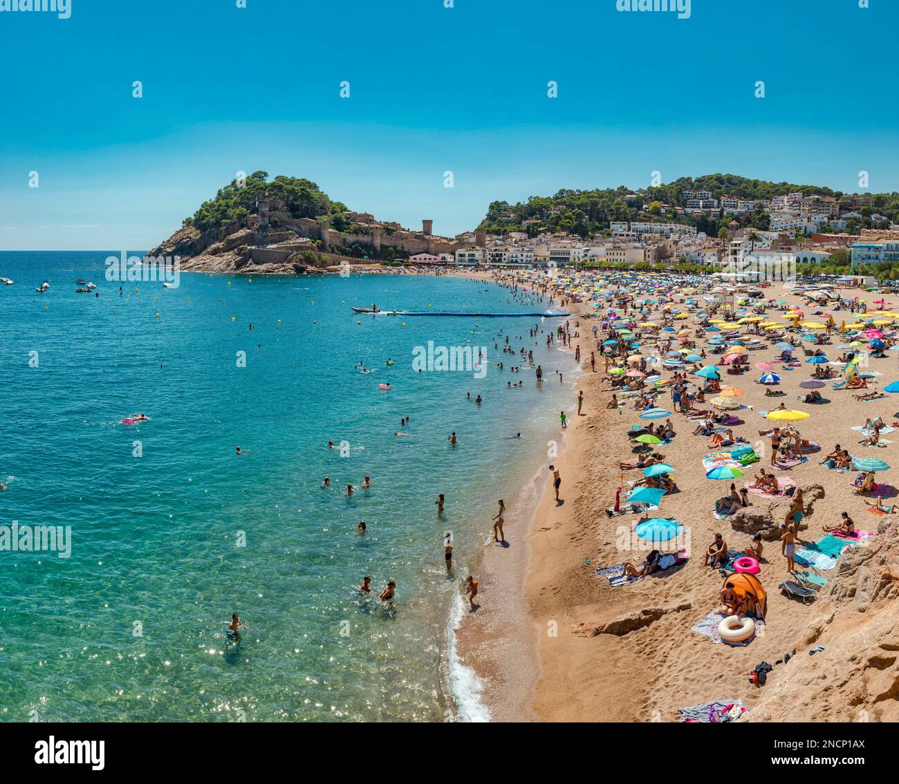 Platja Gran beach with a view at the old city wall and Cap de Tossa ...