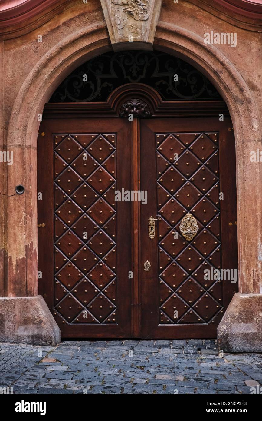 Old ornamental Wooden door in ancient medieval design in touristic city ...