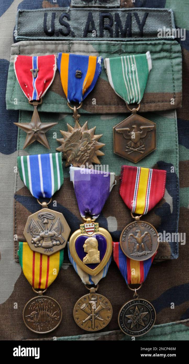 A U.S. Army veteran proudly displays his medals earned in service in ...
