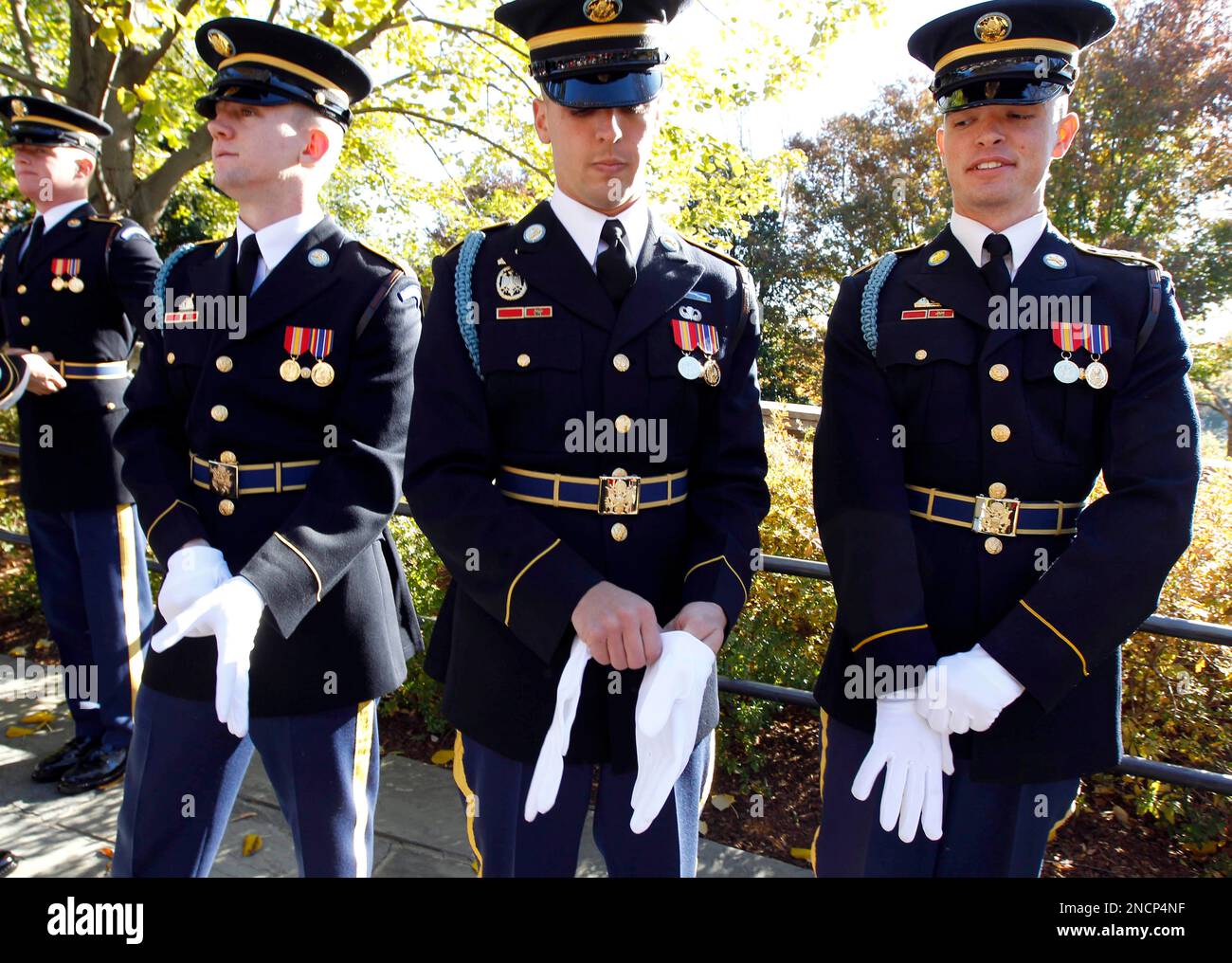 Members of the Honor Guard, from left, Pvt. Matthew Byers, Spc. Michael ...
