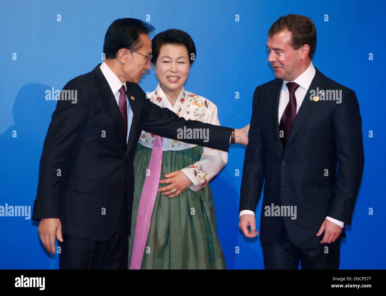 South Korean President Lee Myung-bak, left, and his wife Kim Yoon-ok, center, welcome Russian ...