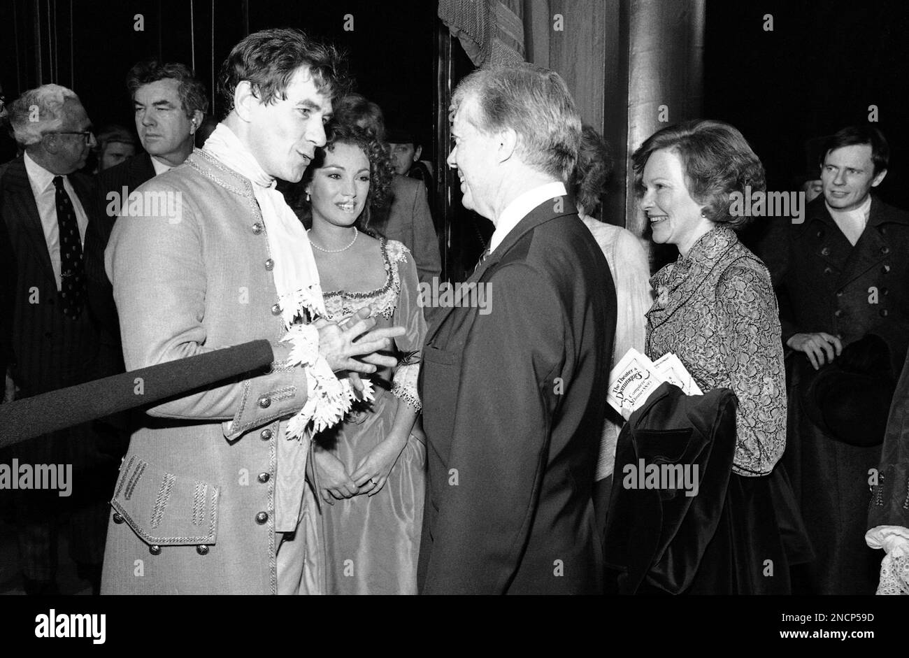President Jimmy Carter and first lady Rosalynn Carter go up onto the ...