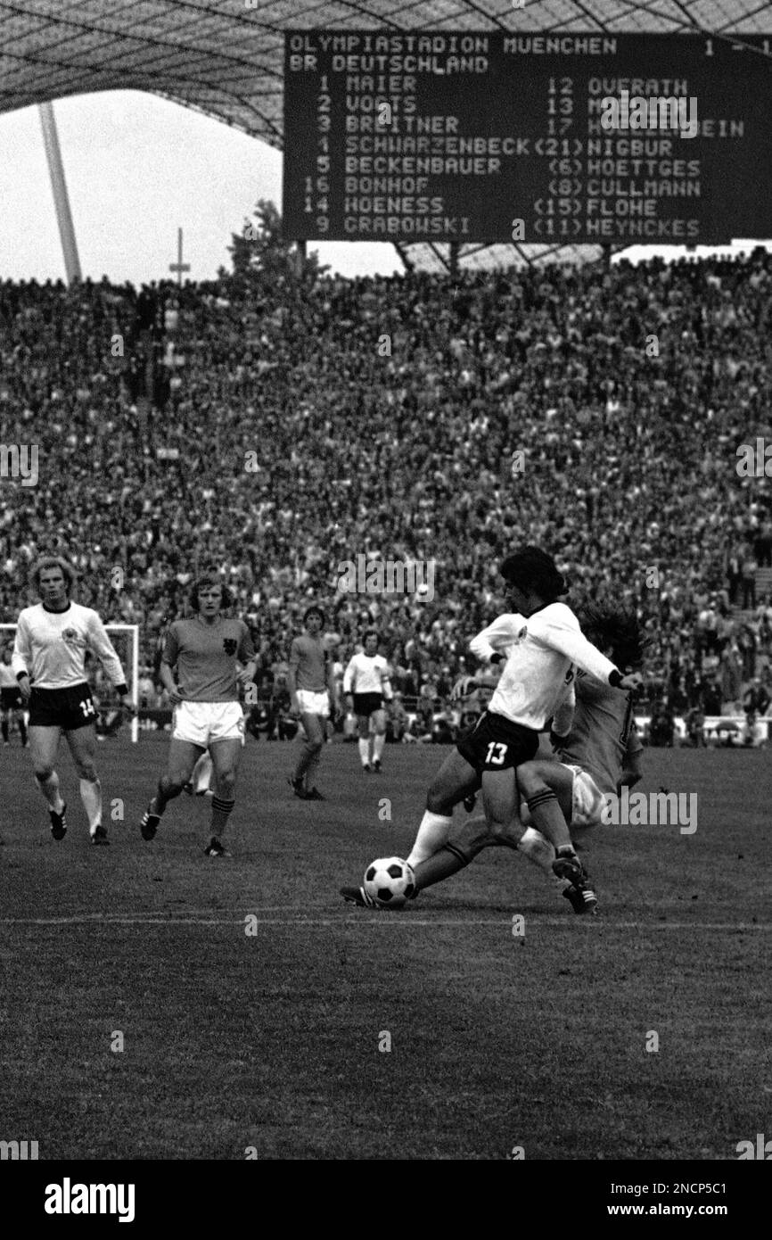 German forward Gerd Mueller, second from right, is tackled by an ...