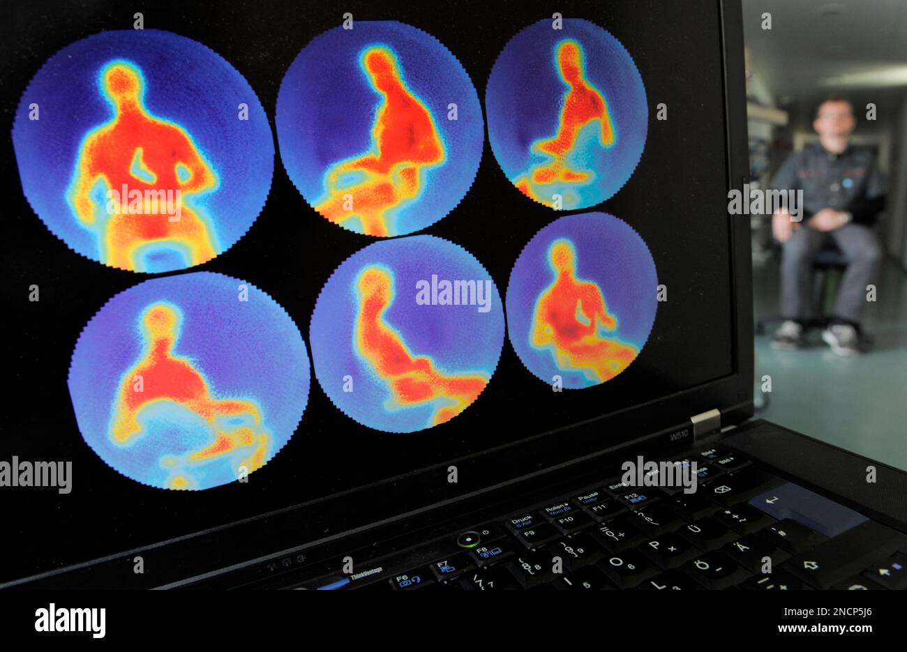 A laptop shows pictures of a passive terahertz (THz) security camera at ...