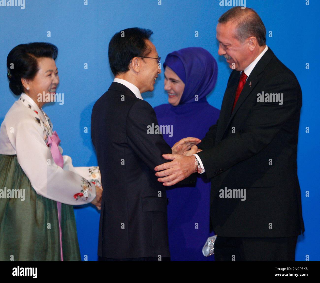 South Korean President Lee Myung-bak, 2nd left, and his wife Kim Yoon ...