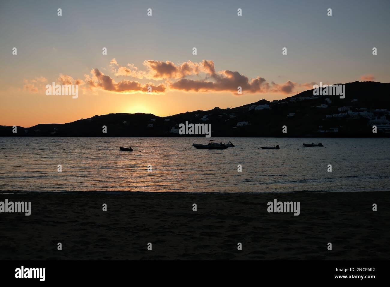 View of a beautiful sunset at the Mylopotas beach in Ios Greece Stock ...