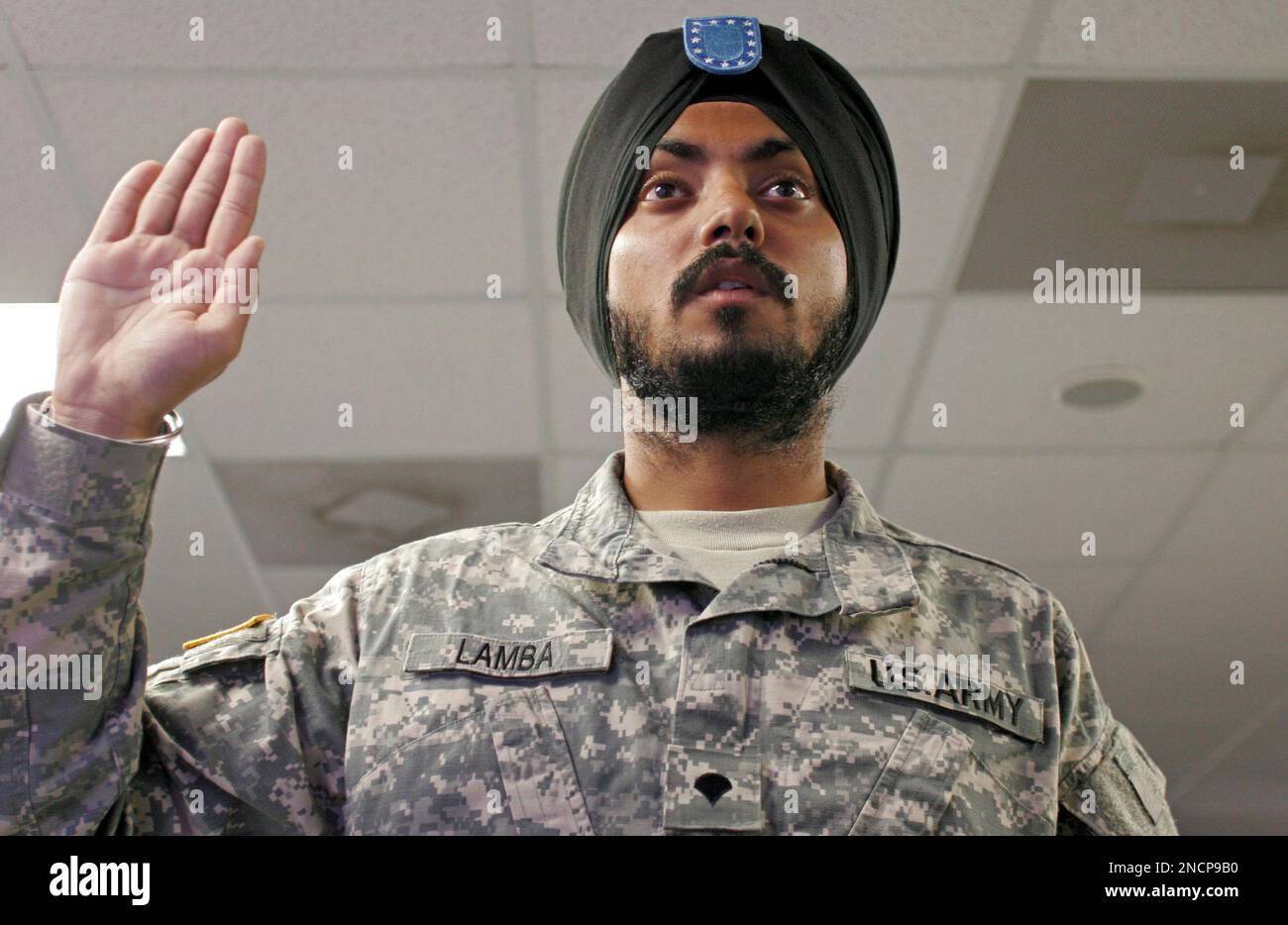 U.S. Army Spc. Simran Lamba, takes the oath of citizenship to become a ...