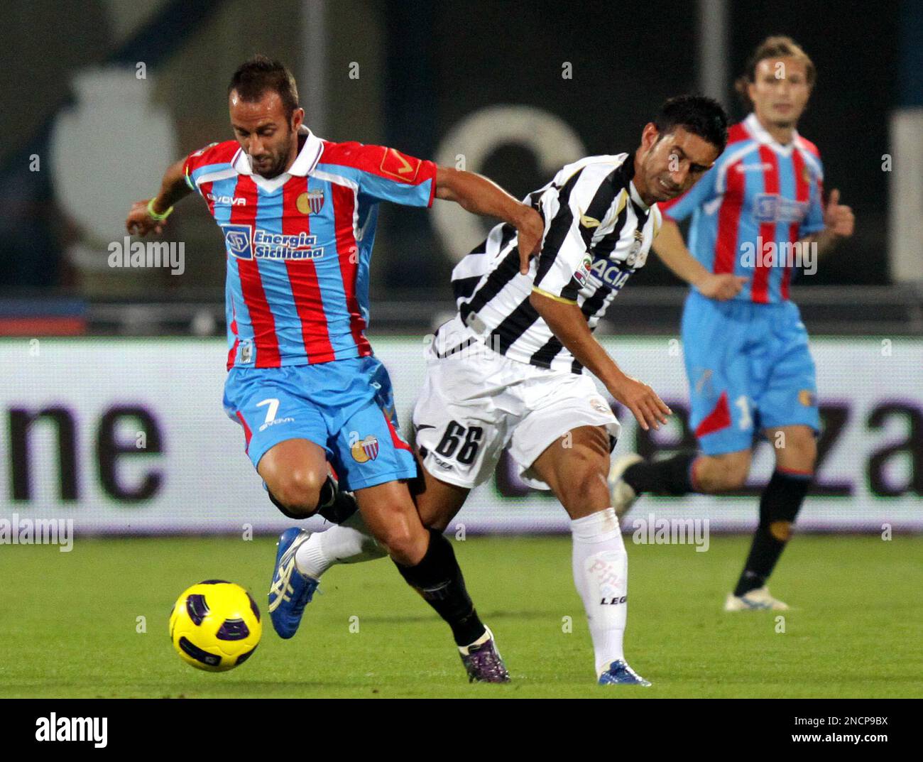 Catania's Giuseppe Mascara, left, vies for the ball with Udinese's ...
