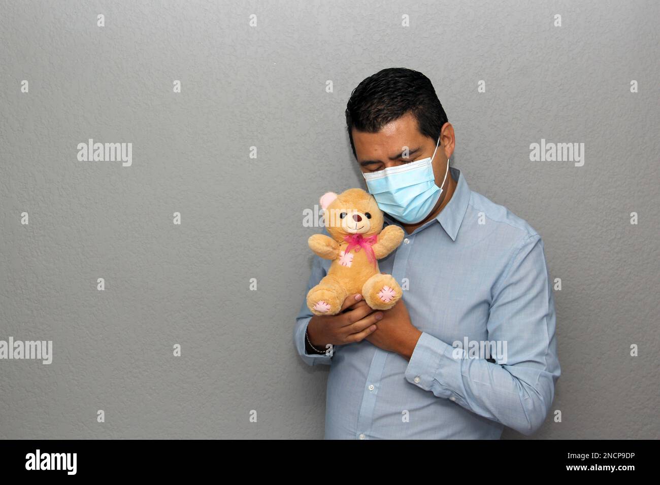 Valentine's new normal, latino man with blue shirt, clinical use ...