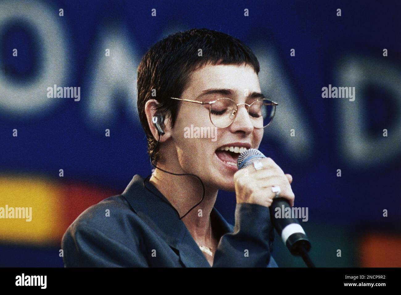 Irish Singer Sinead O’Connor accompanies Peter Gabriel (unseen) on ...