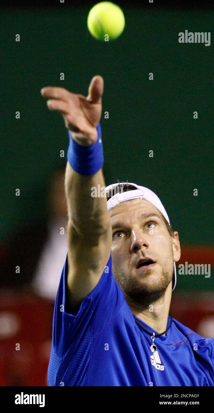 Austrian Jurgen Melzer serves to Columbia's Santiago Giraldo during ...