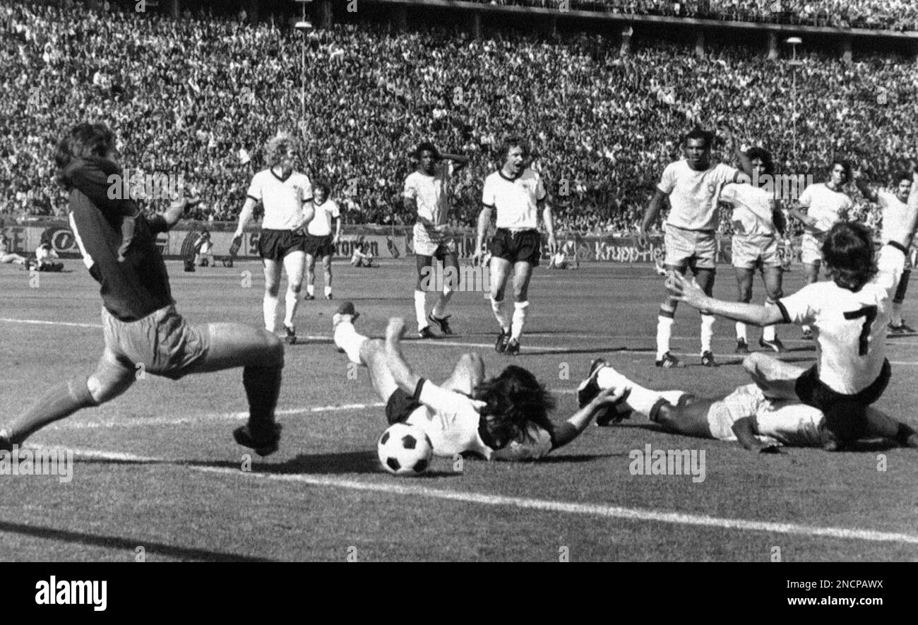 Brazilian goalkeeper Emerson Leao, left, saves from German attack in a ...