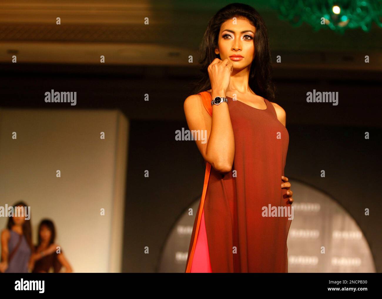 An Indian model displays a Rado watch from the 'centrix' collection at ...