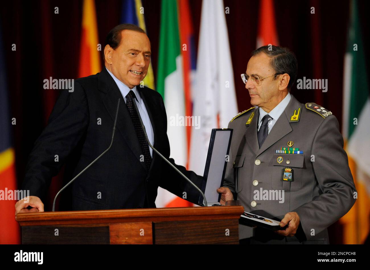 Italian Premier Silvio Belusconi,left, greets Italian Finance Police ...