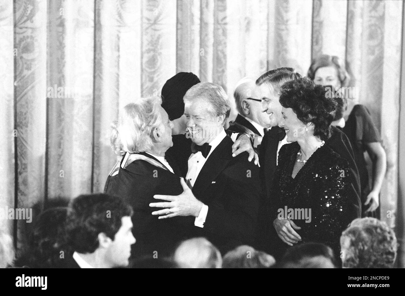 President Jimmy Carter gives composer-conductor Leonard Bernstein, left ...