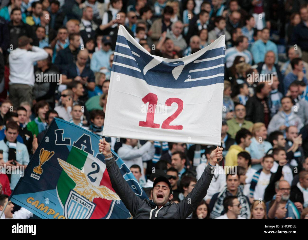 Lazio's fans wave their flags during the Serie A soccer match between ...