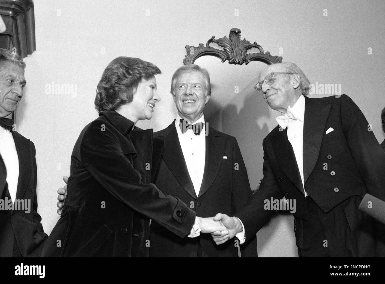 World famous conductor Aaron Copland, right, shakes hands with Rosalynn ...