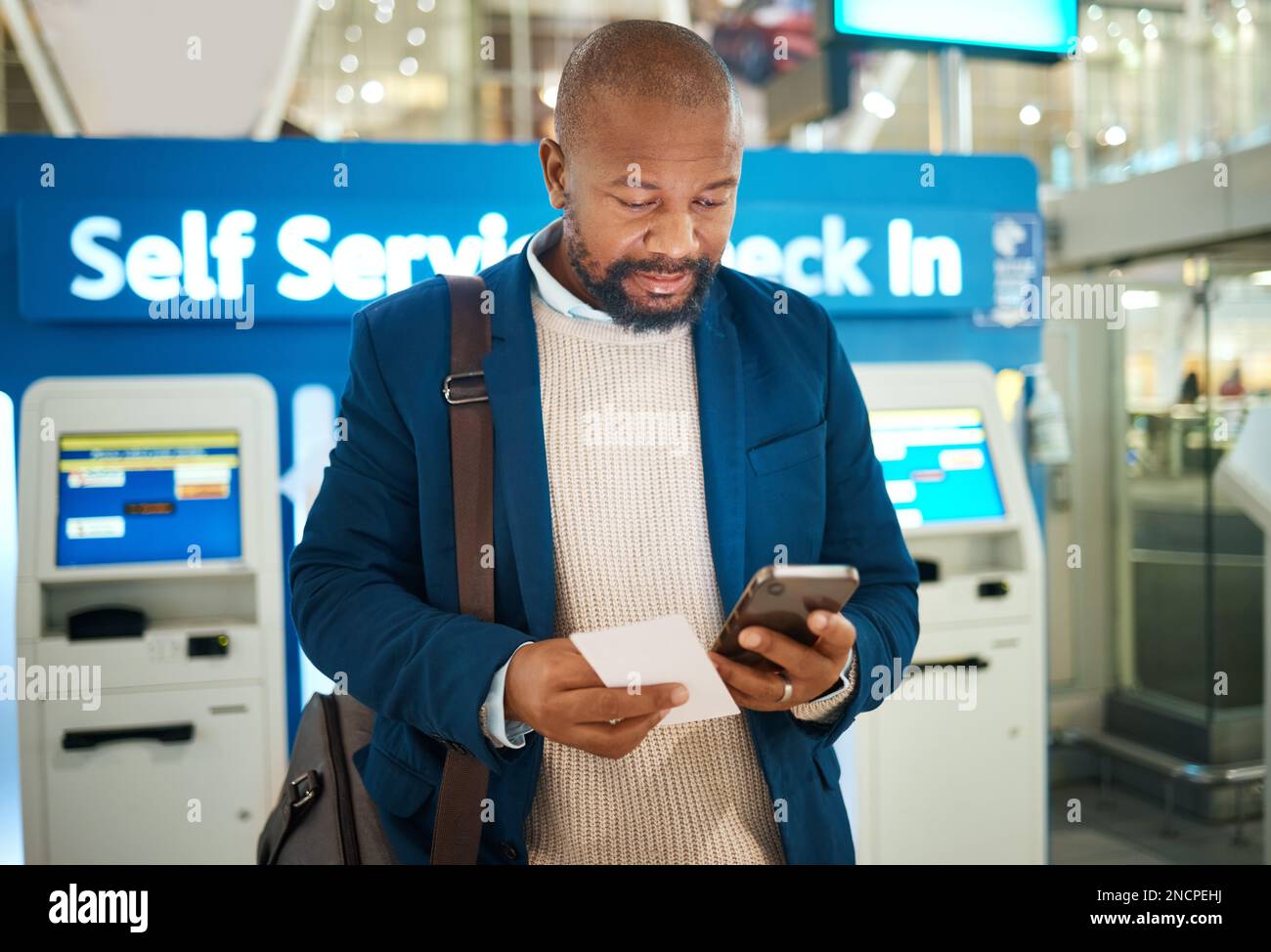 Black man, plane ticket self check in and phone app with international ...