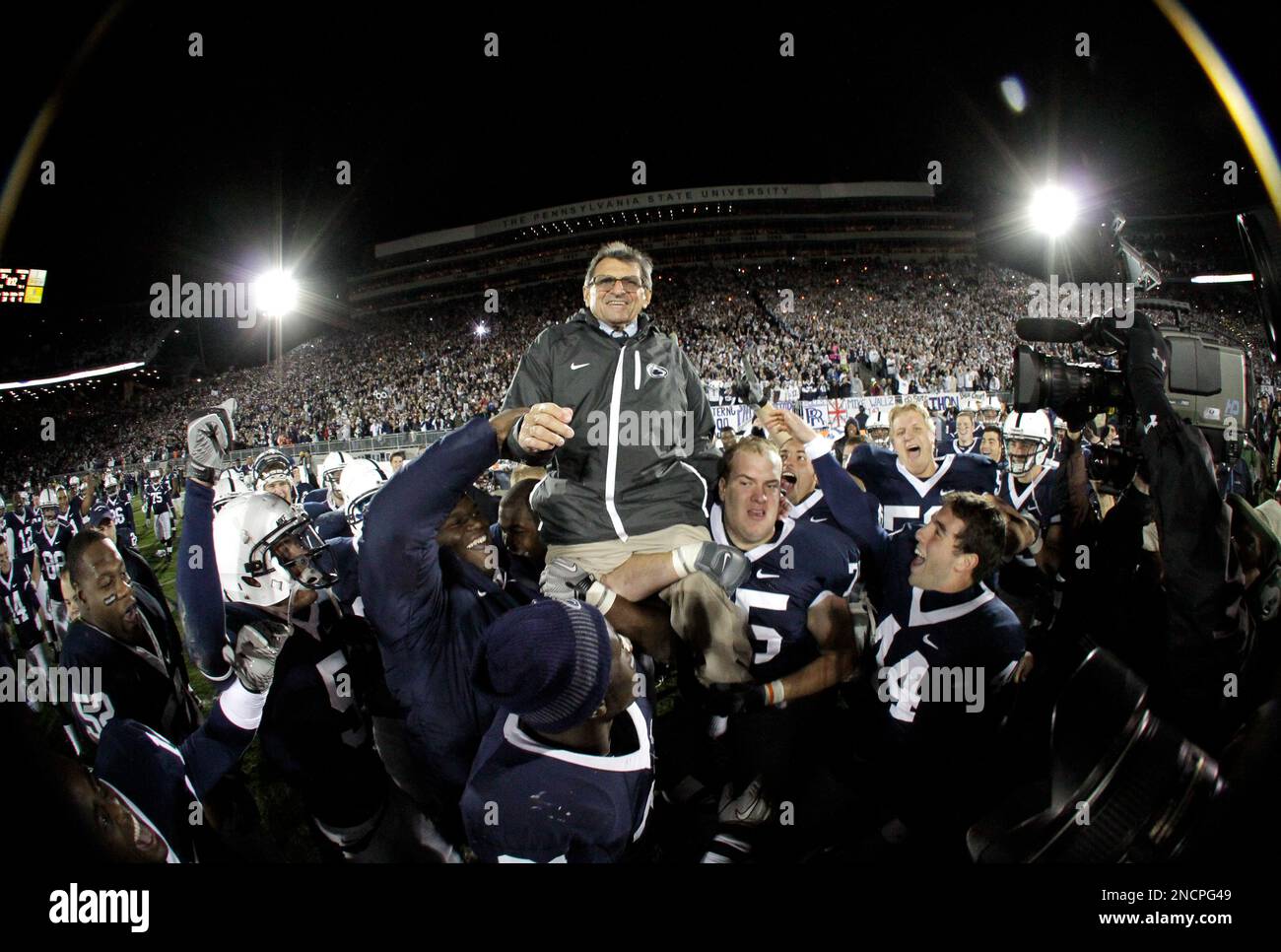 Penn State coach Joe Paterno is carried off the field by his players ...