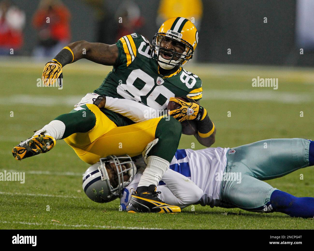 Green Bay Packers wide receiver James Jones is brought to the ground by ...