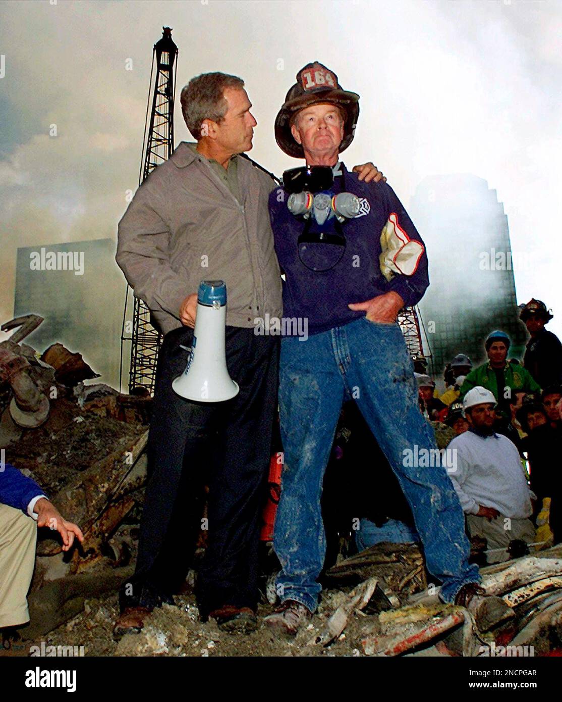 FILE - In this Sept. 14, 2001 file photo, President George W. Bush puts ...