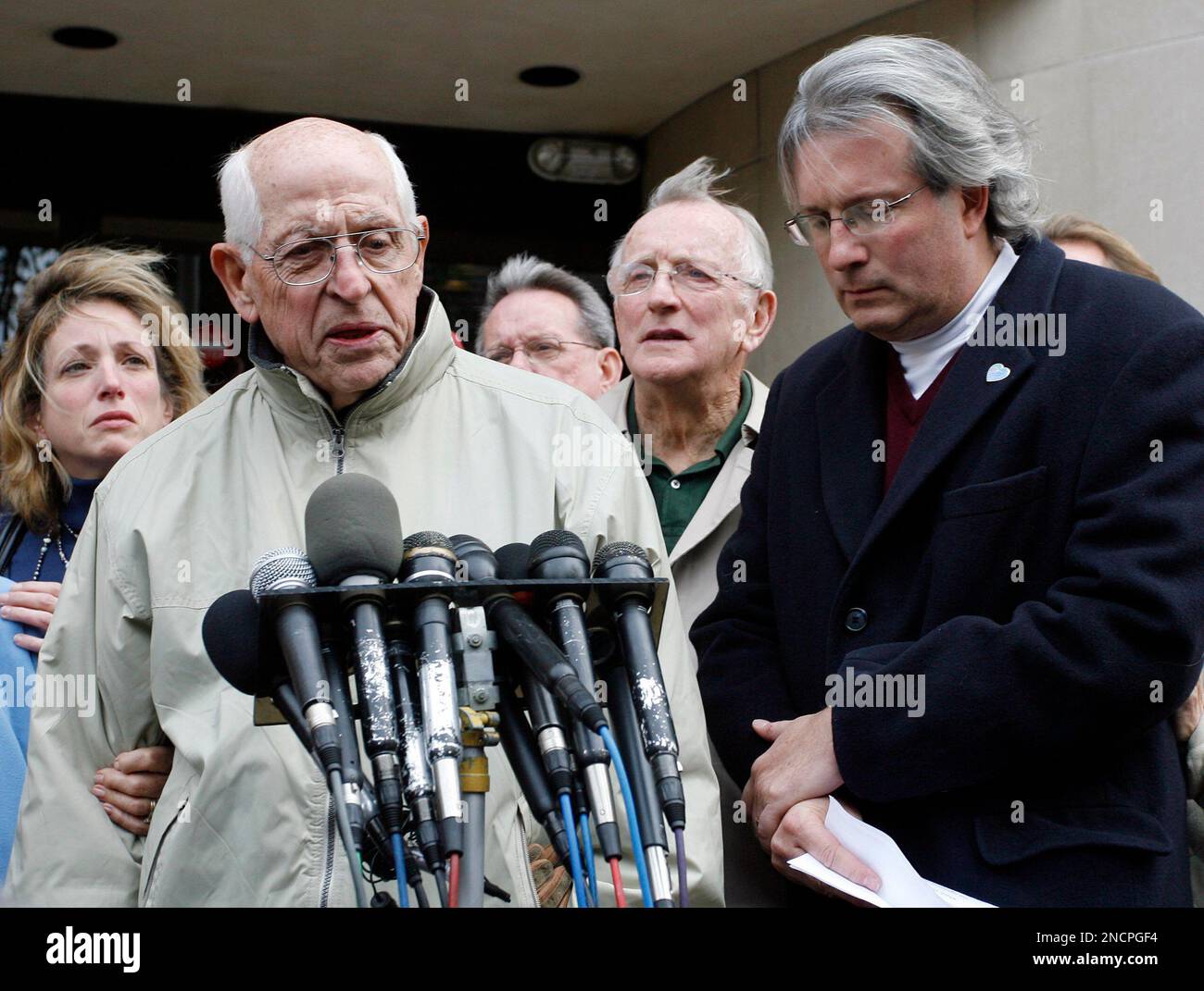 Dr. William Petit Jr., right, listens as Richard Hawke, left, father of ...
