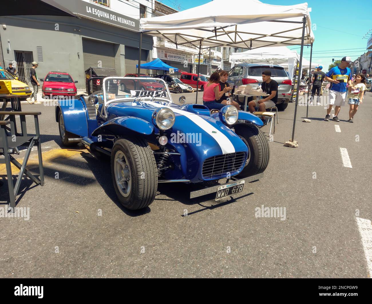 Old classic 1970s Lotus Seven sport car in the street. Open top two ...