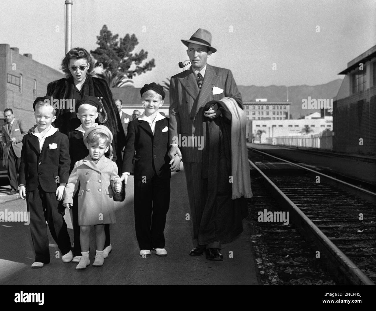 Dixie Lee Crosby and her four sons welcome Bing Crosby home from a South American trip, Oct. 30 ...