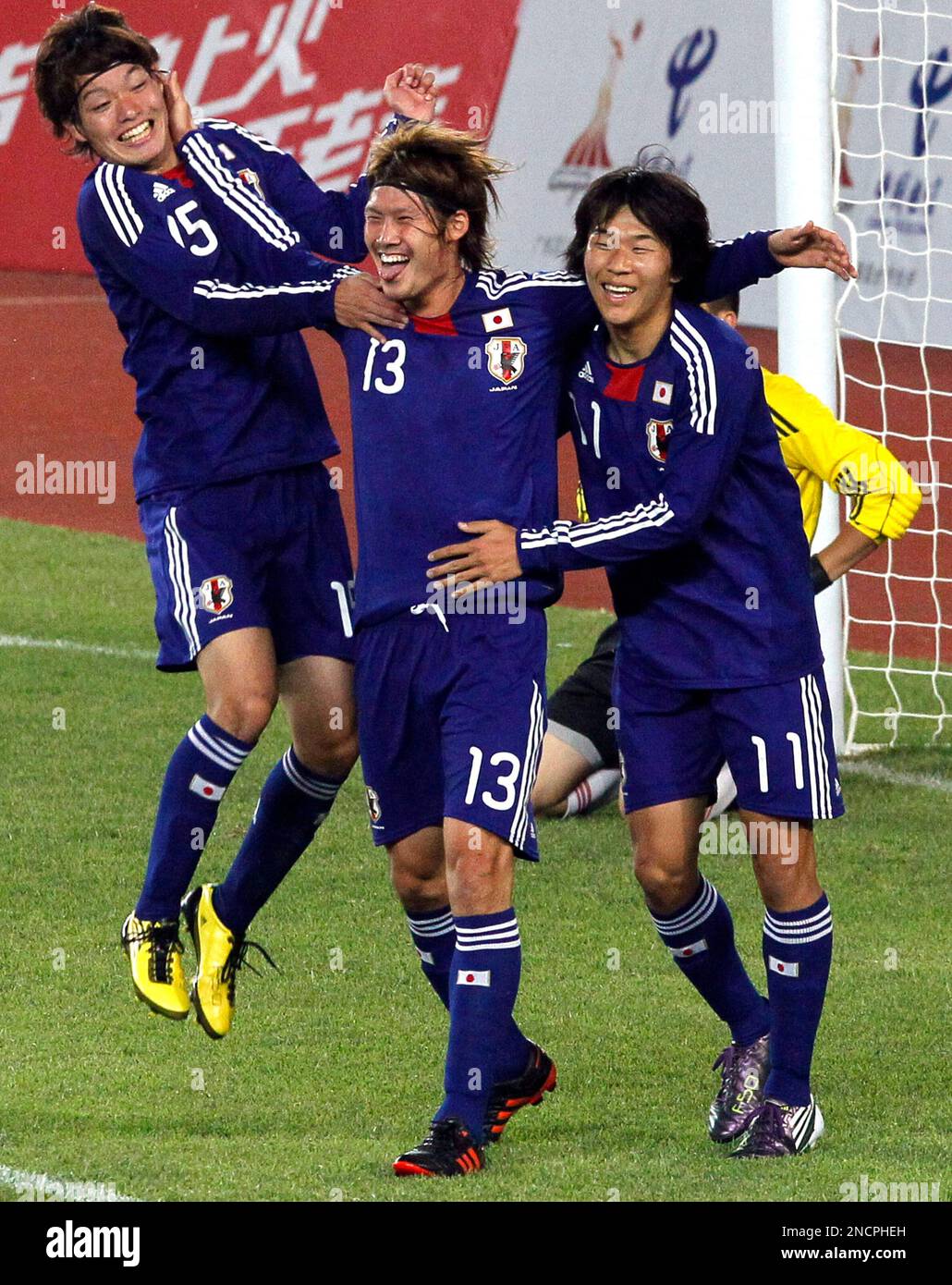Japan's Daisuke Suzuki (13) celebrates after scoring against China with ...