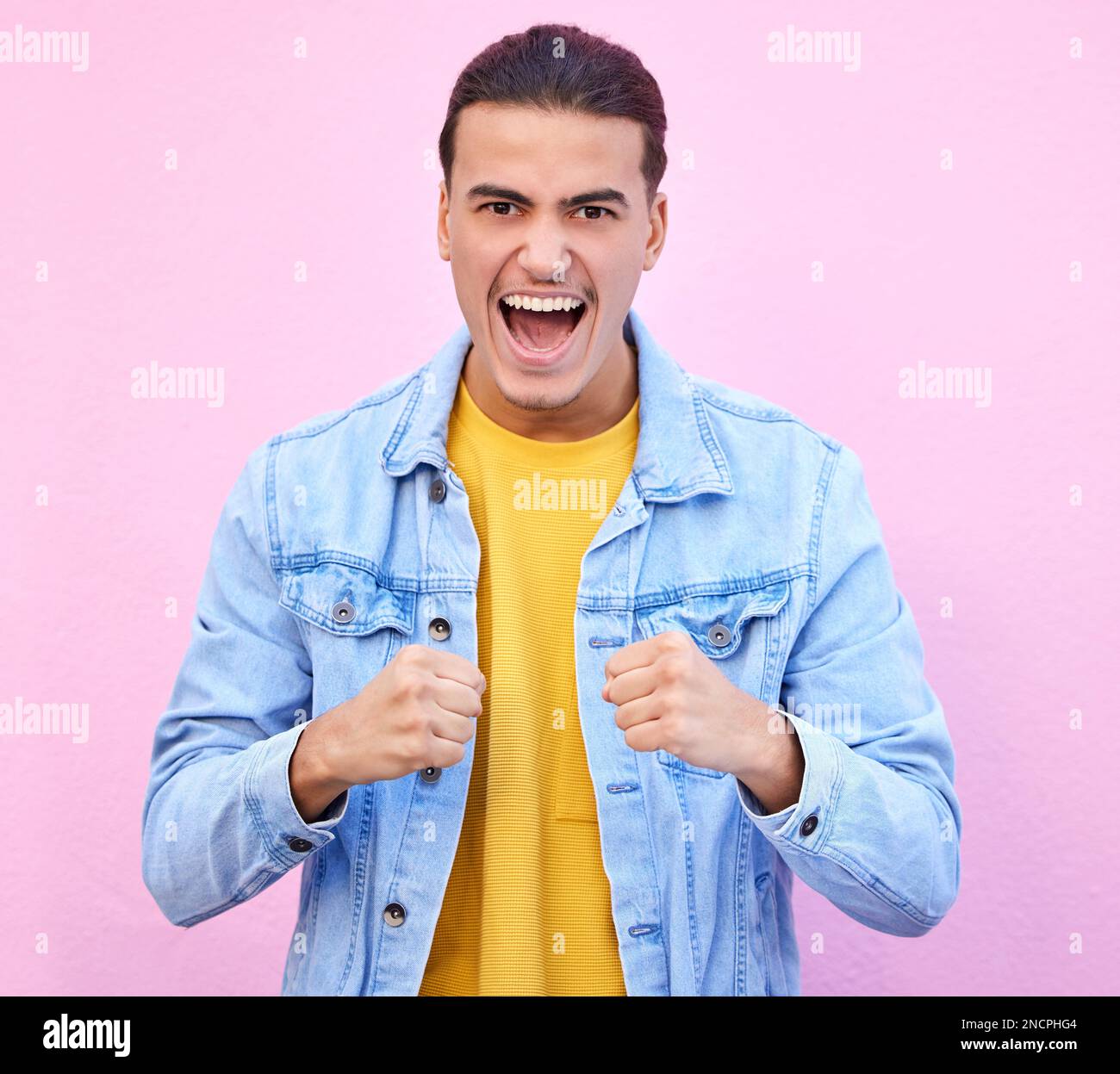 Portrait, winner and shouting in victory with a man in studio on a ...