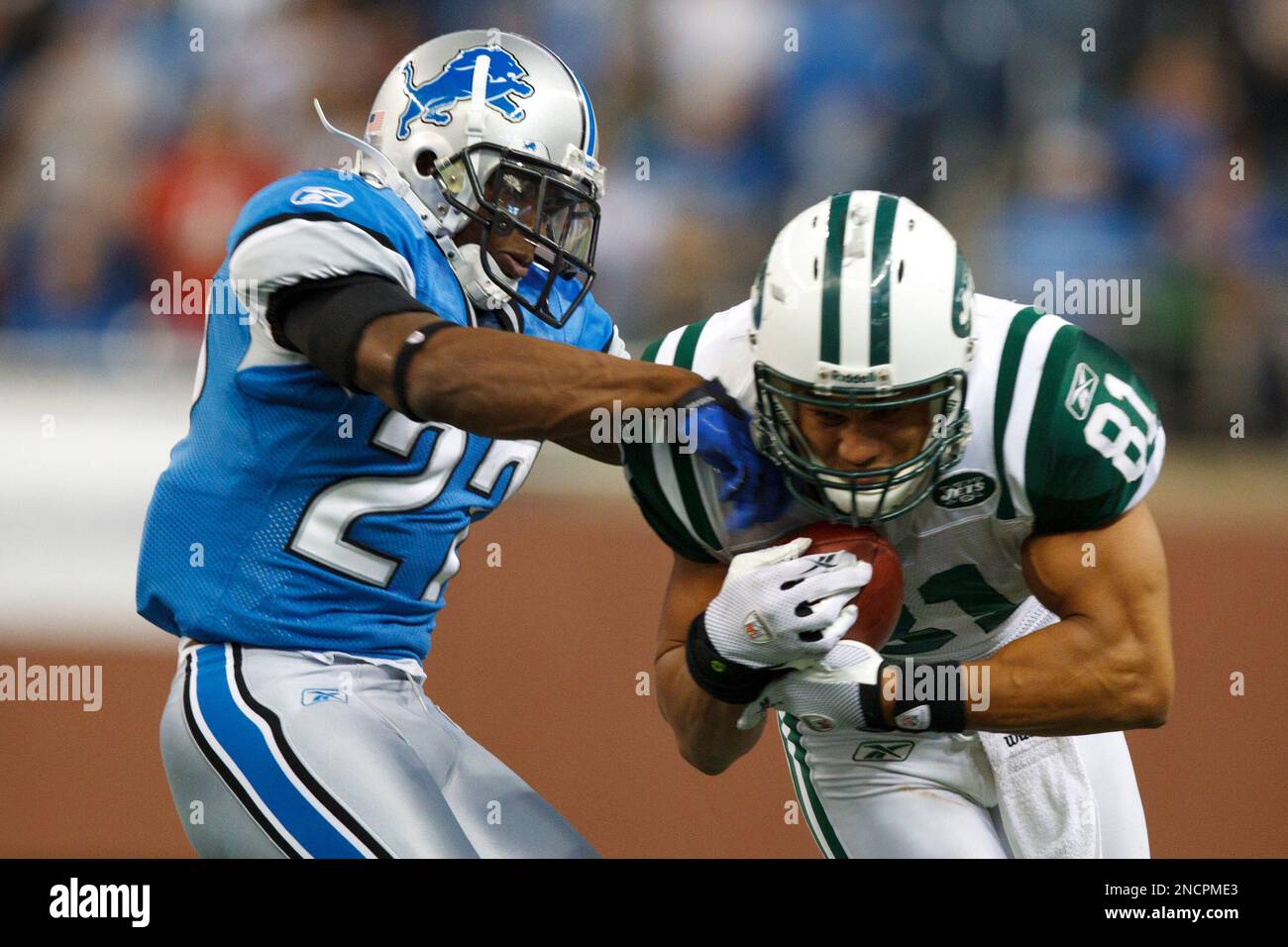 Detroit Lions cornerback Alphonso Smith (27) graps New York Jets tight ...