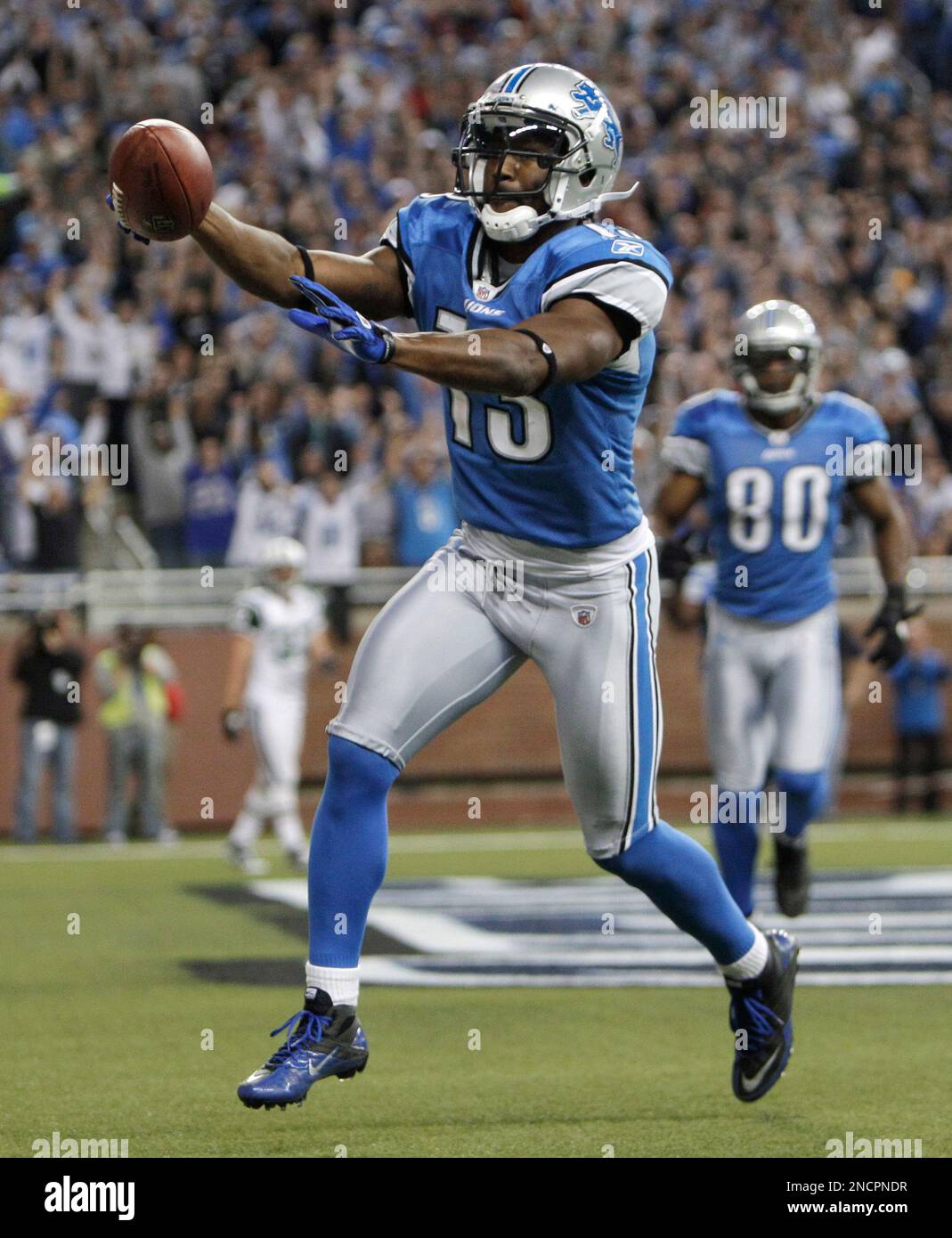Detroit Lions wide receiver Nate Burleson (13) celebrates catching a 2 ...