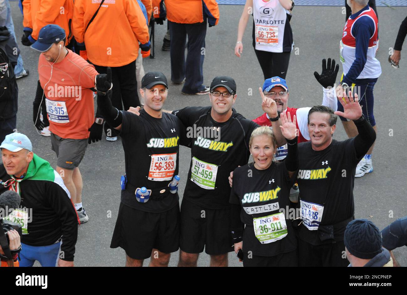 SUBWAY's Jared Fogle, second left, crosses the finish line of the 2010 ...