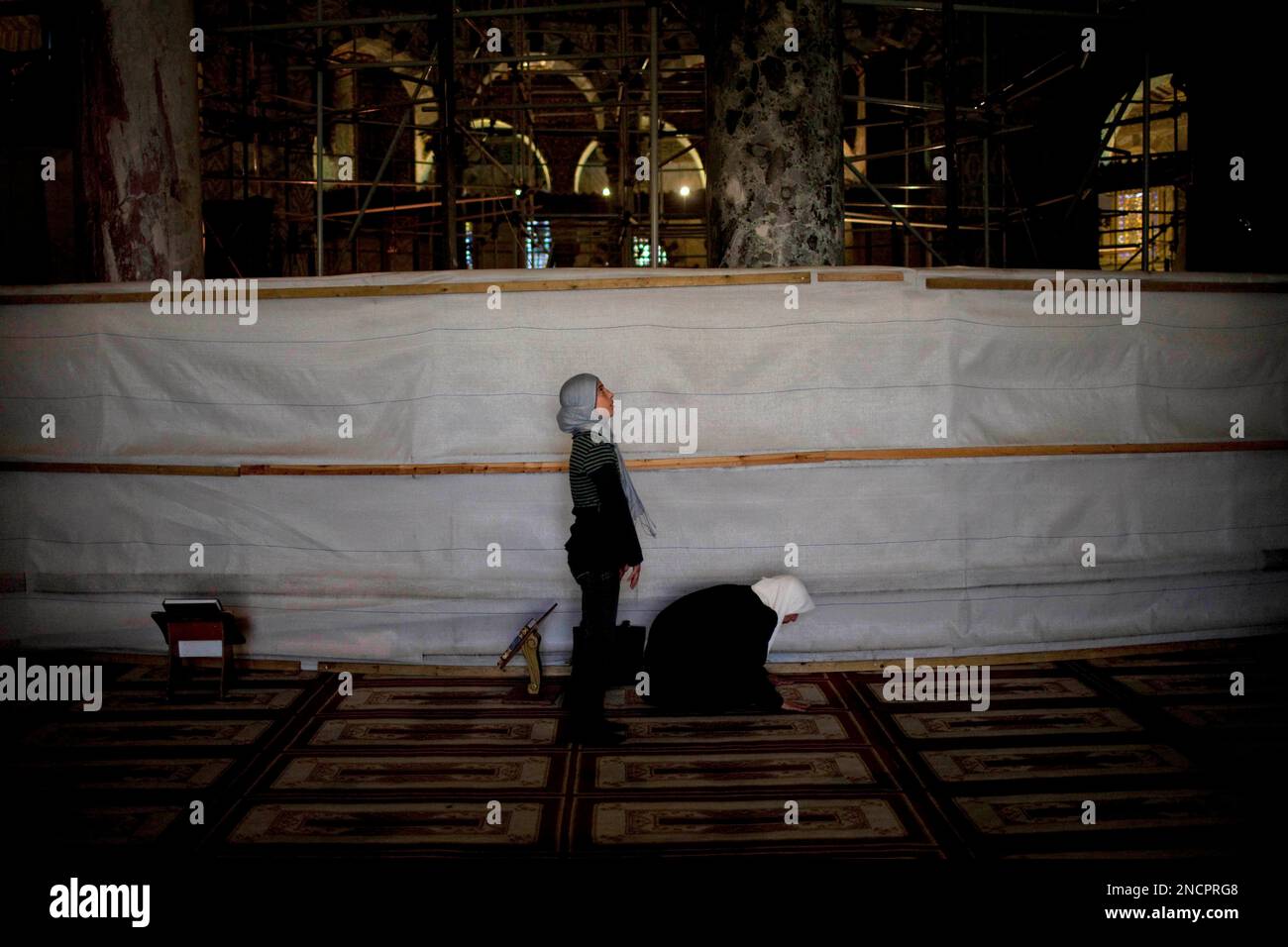 Palestinian Muslim women pray inside the Dome of Rock Mosque in the Al ...