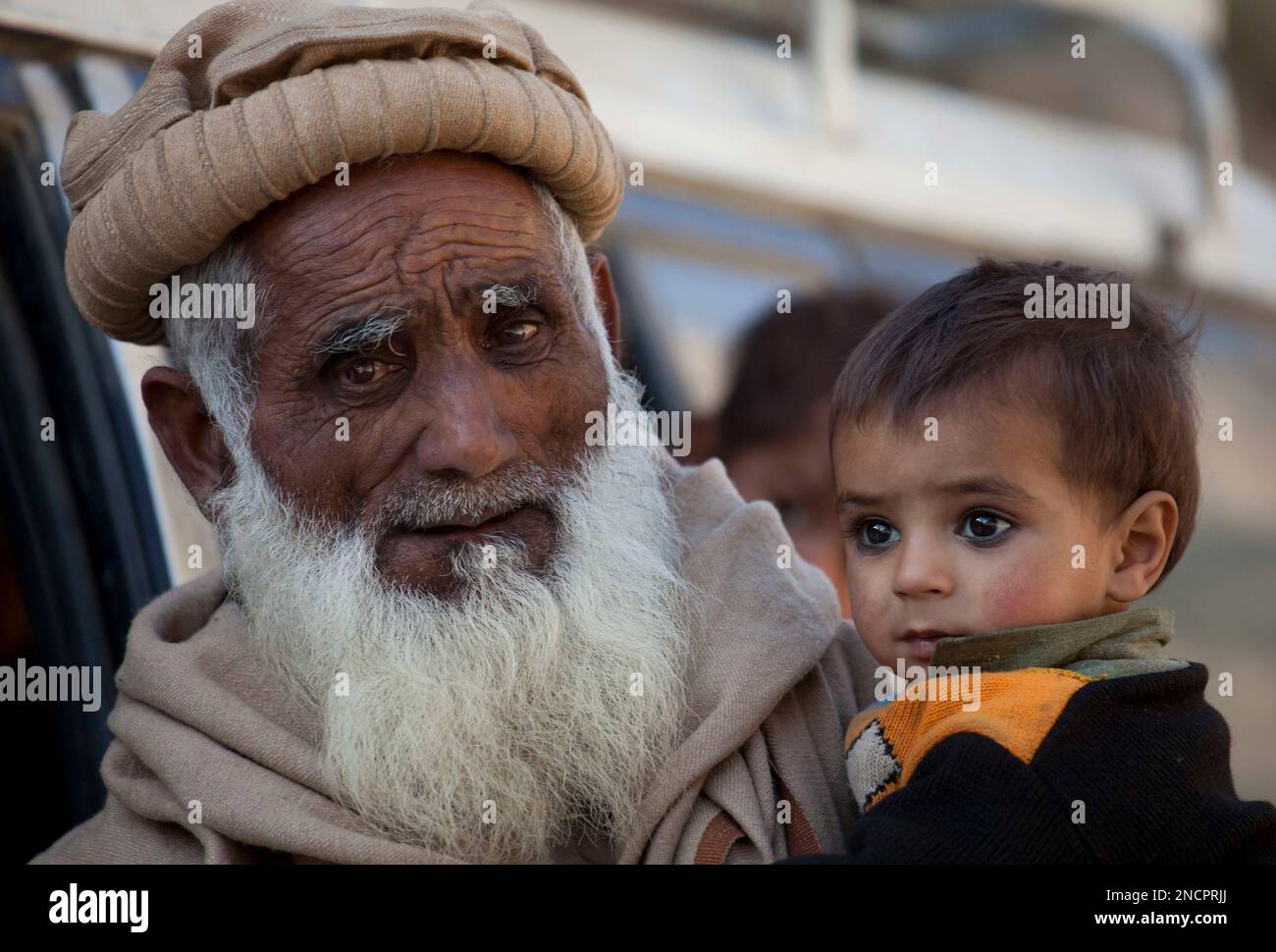 In this Nov. 2, 2010 picture, Rehmat Khan and a child wait with their ...