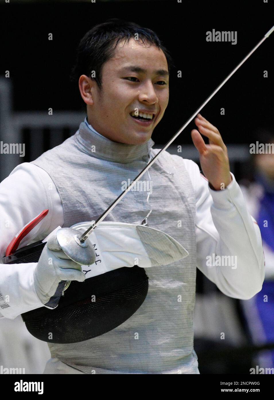 Japan's Yuki Ota reacts after defeating Britain's Thys Melia in the men's single foil category ...