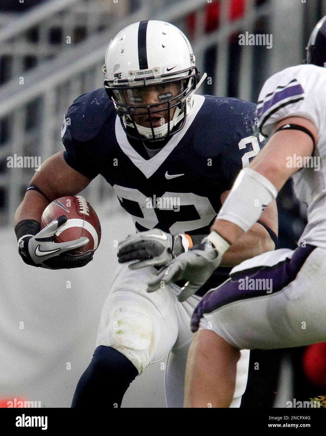 Penn State running back Evan Royster, left, runs during the second ...