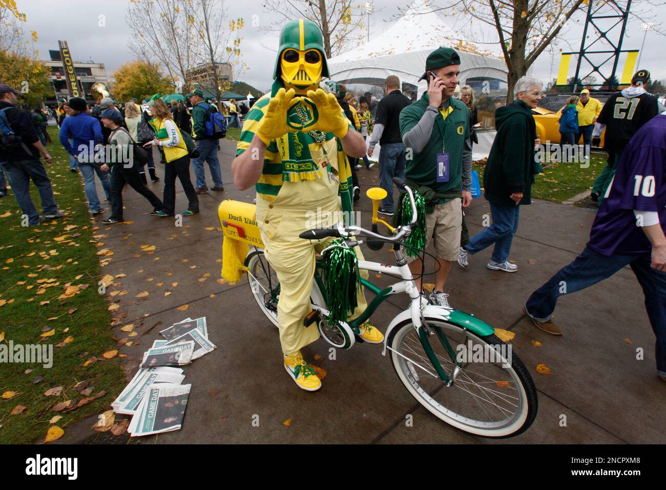 Oregon fan Max Maurer, known as duck vader, is shown on his bike in the ...