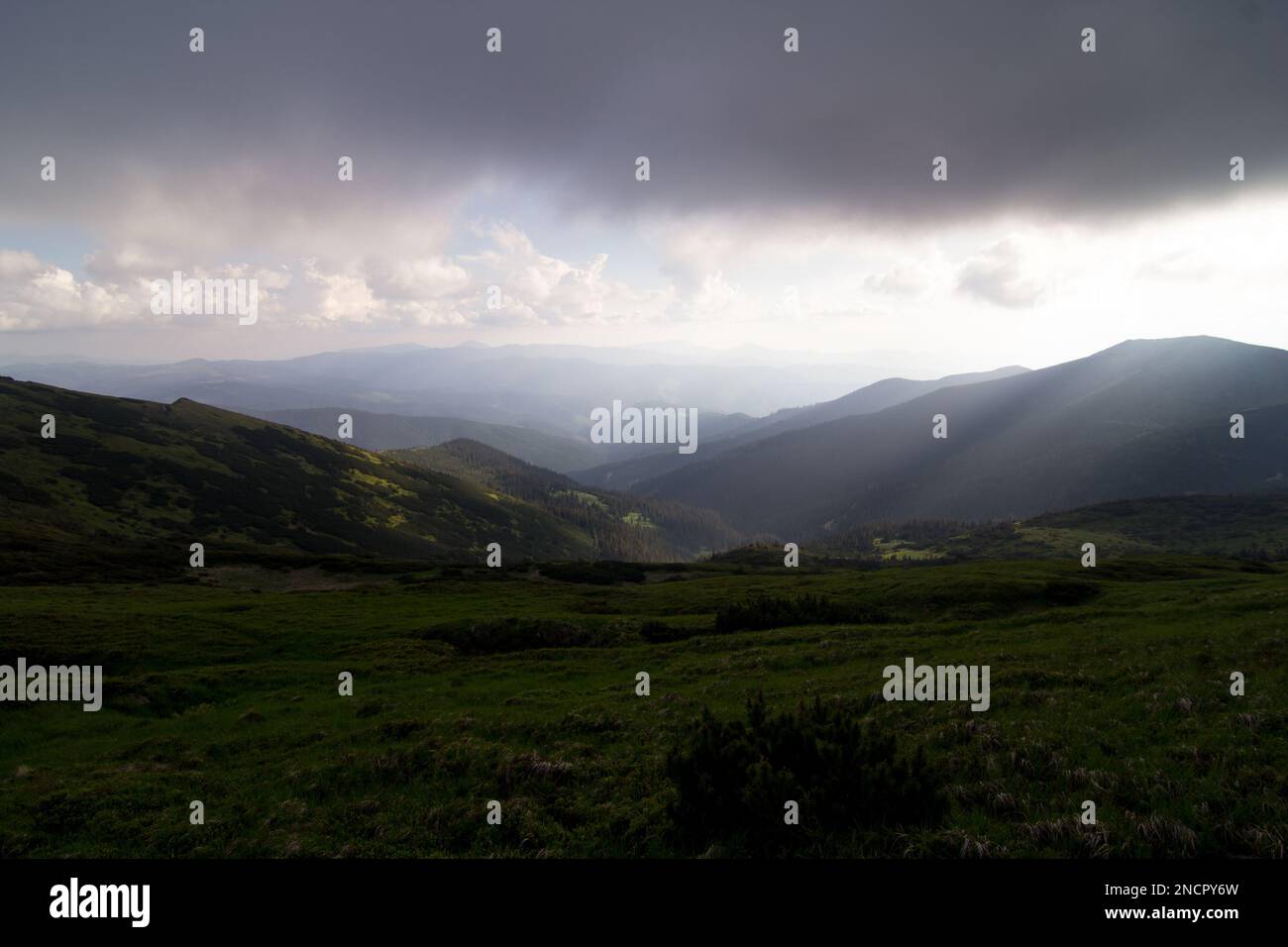 Low lying rain clouds above hill landscape photo Stock Photo - Alamy