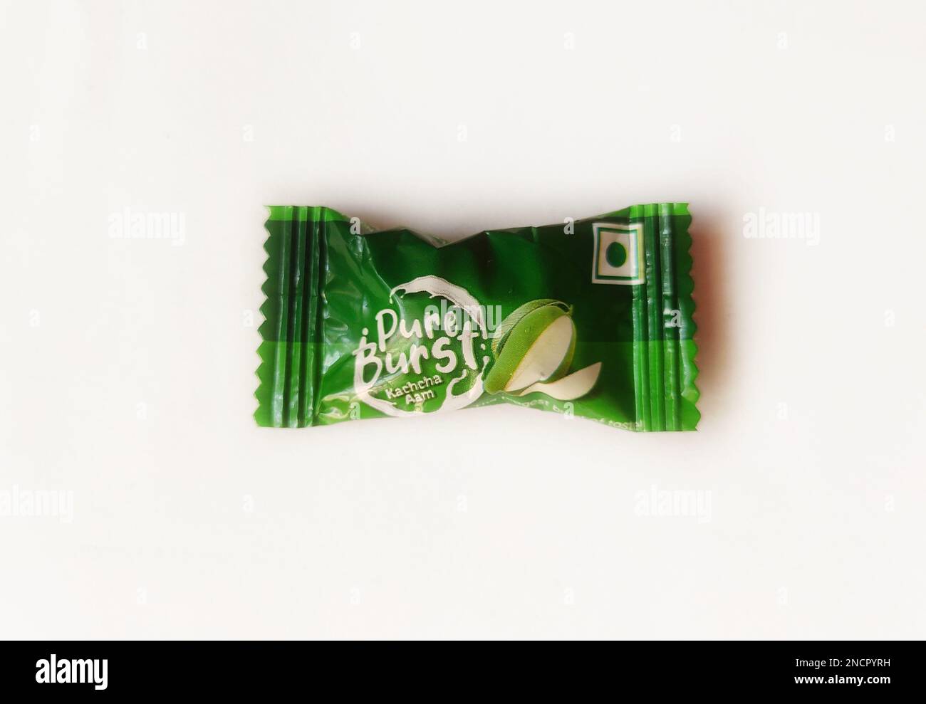Pure Burst Kachcha Aam candy in isolated background Stock Photo - Alamy