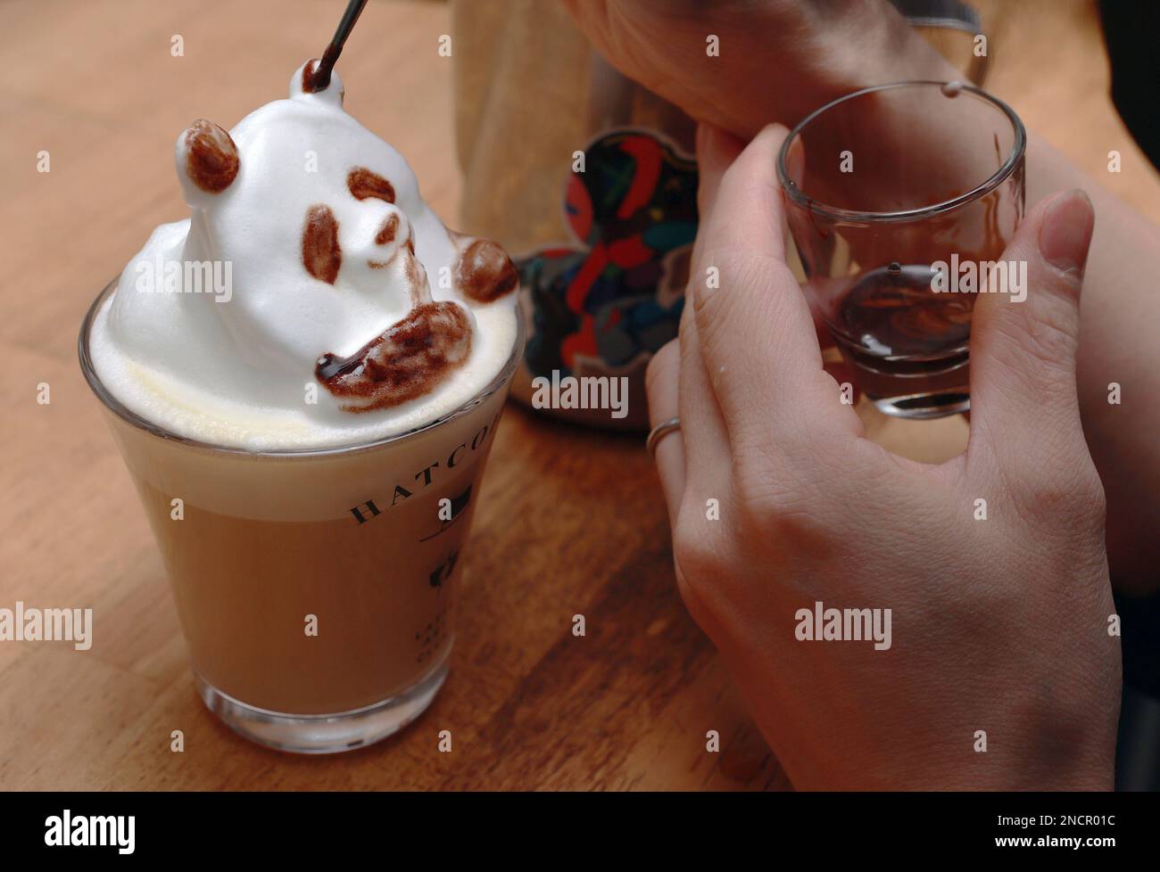 Kohei Matsuno makes a 3D latte art at his coffee shop HATCOFFEE in Tokyo on Feb. 15, 2023. The ...