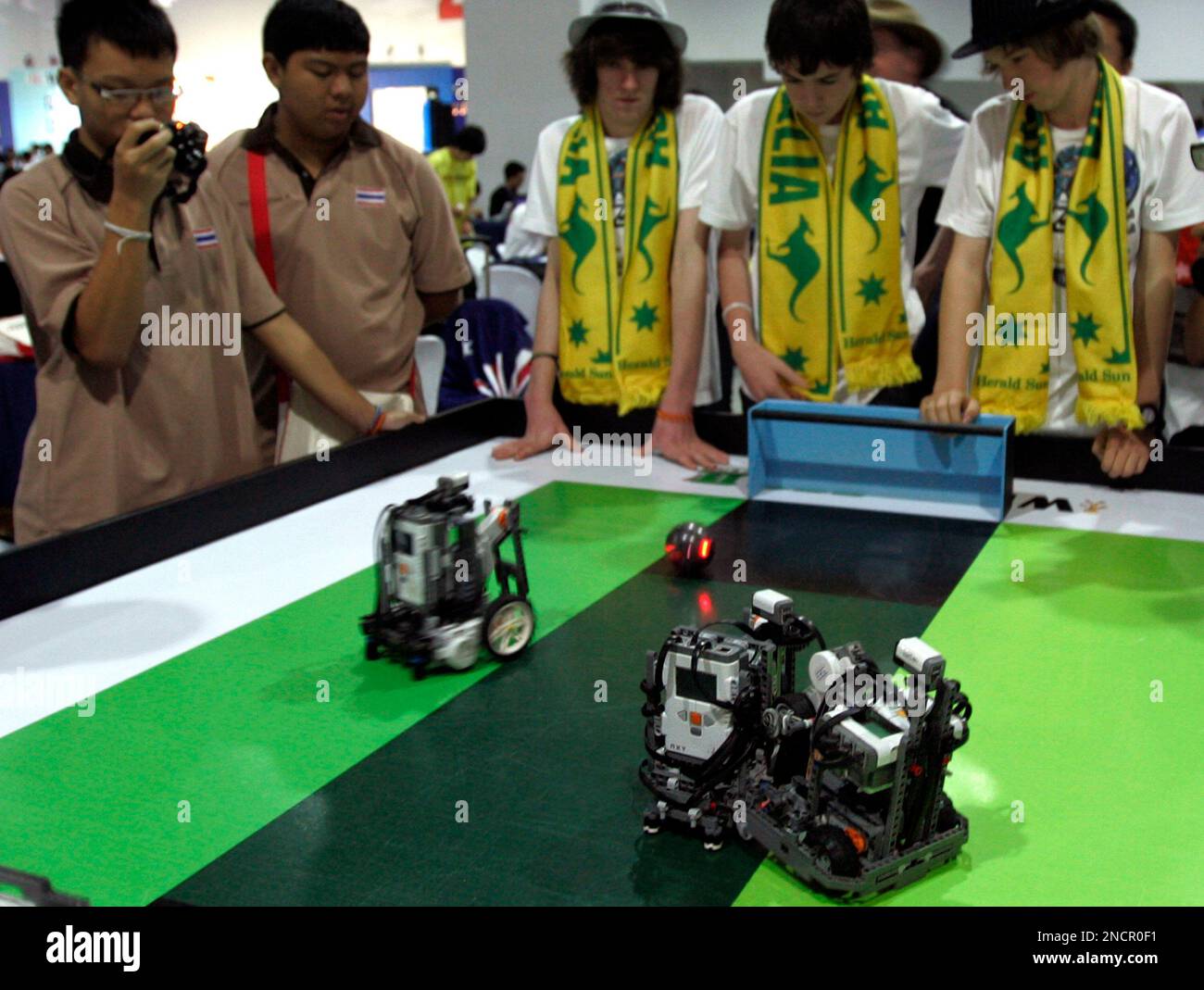 High school students from Australlia and Thailand watch a robot soccer ...