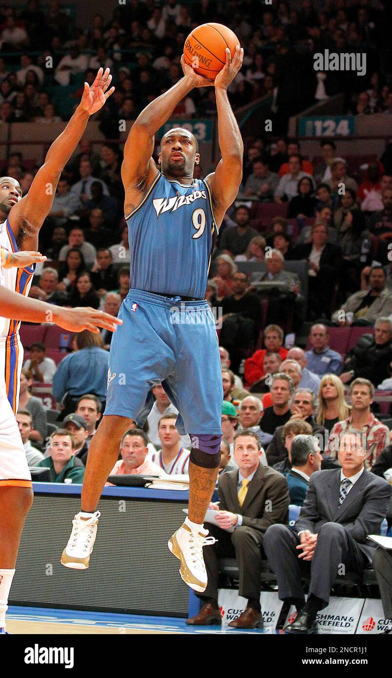 Washington Wizards' Gilbert Arenas (9) goes up to shoot before passing ...